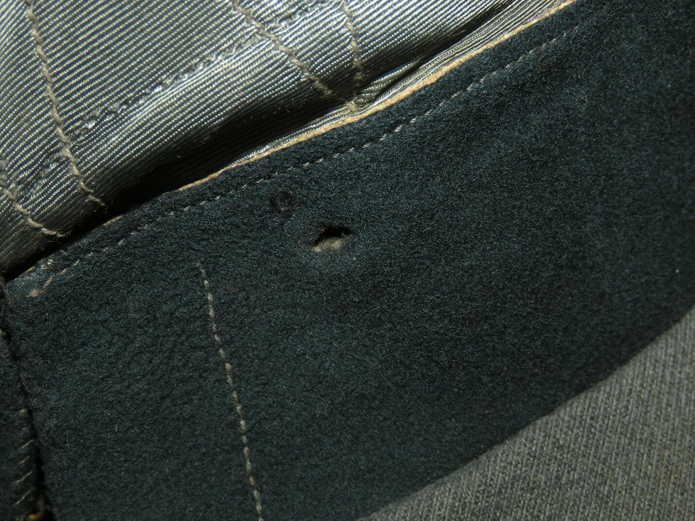 German Wehrmacht officer's tunic with a dark green collar and blue piping