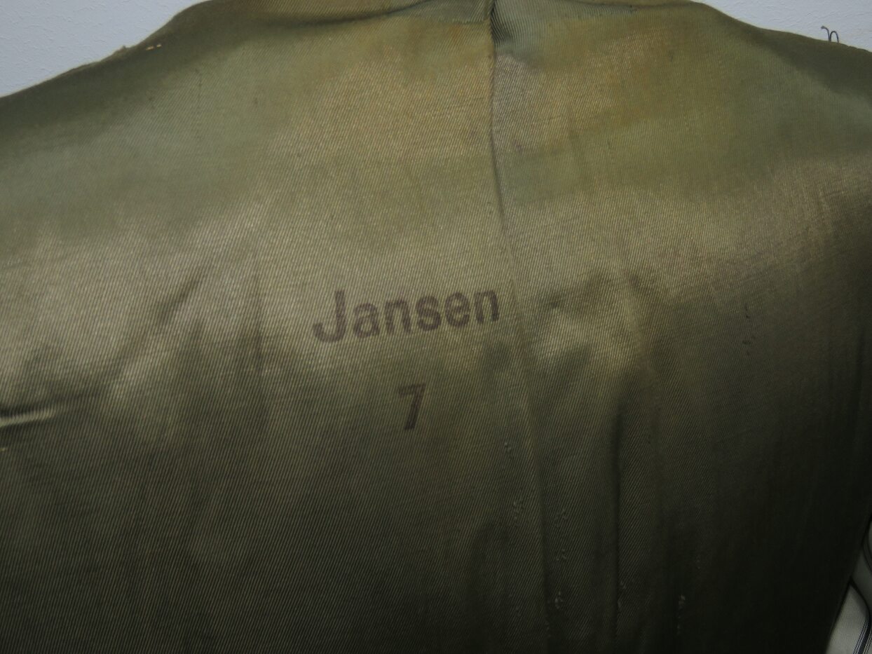 German Wehrmacht officer's tunic with a dark green collar and blue piping