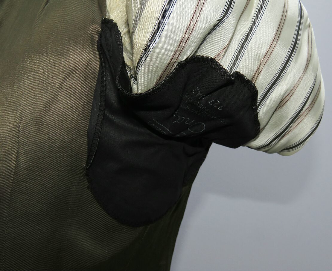 German Wehrmacht officer's tunic with a dark green collar and blue piping