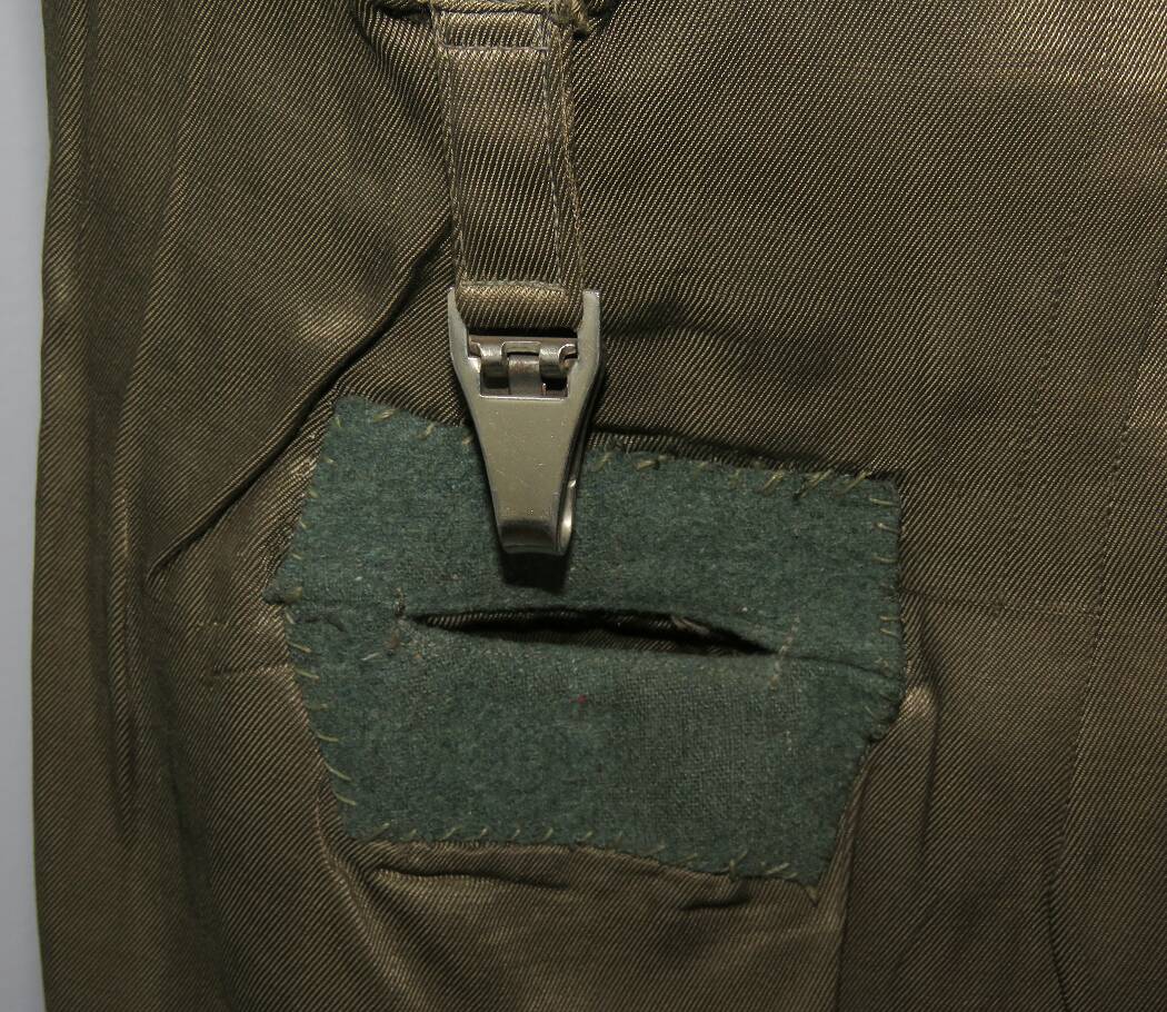 German Wehrmacht officer's tunic with a dark green collar and blue piping