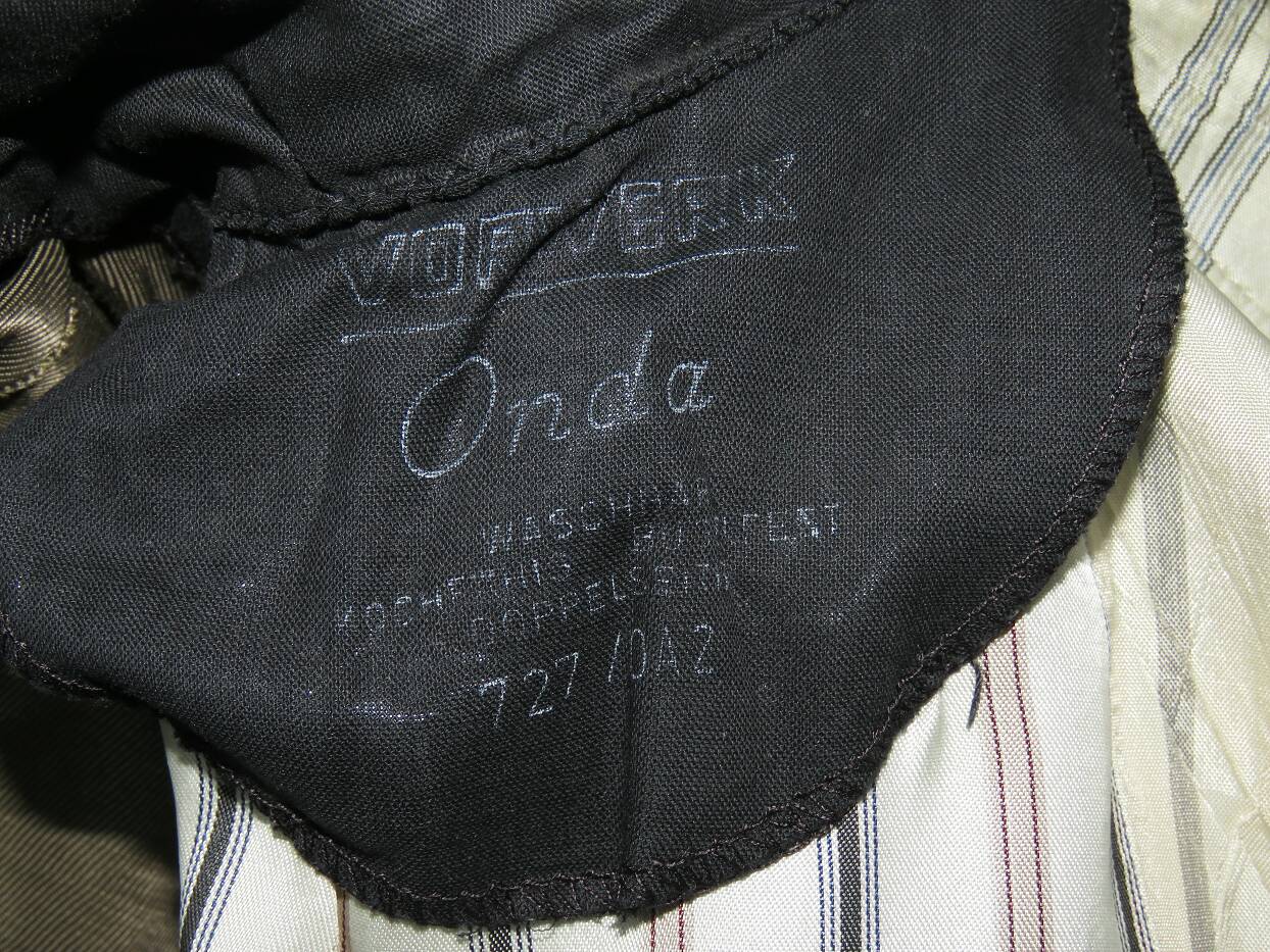 German Wehrmacht officer's tunic with a dark green collar and blue piping