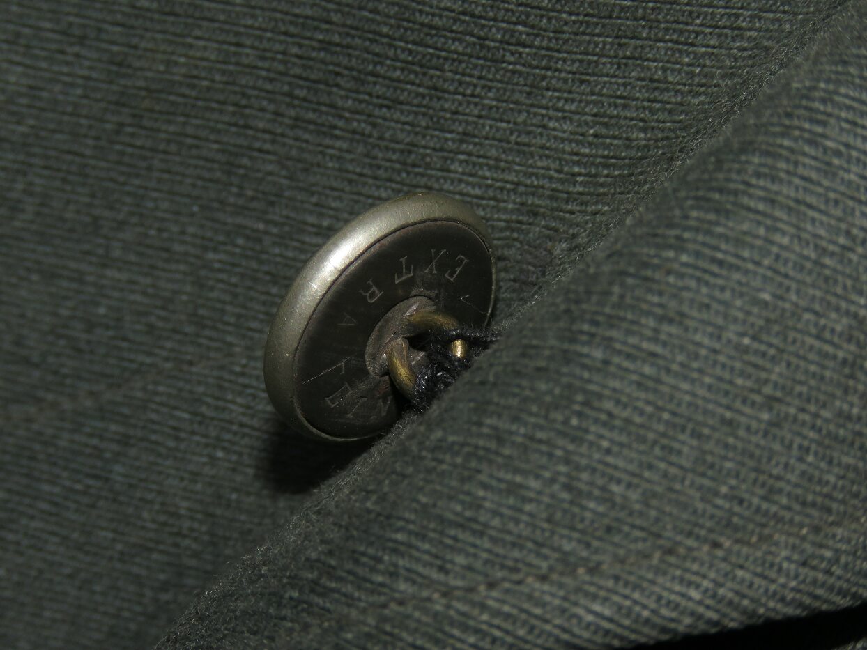 German Wehrmacht officer's tunic with a dark green collar and blue piping