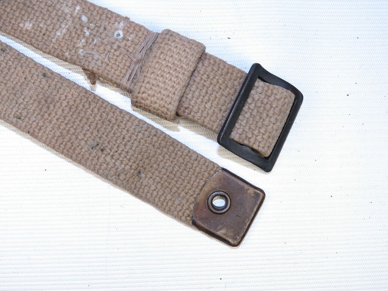 Canvas belt with German insignia, pins and ciphers