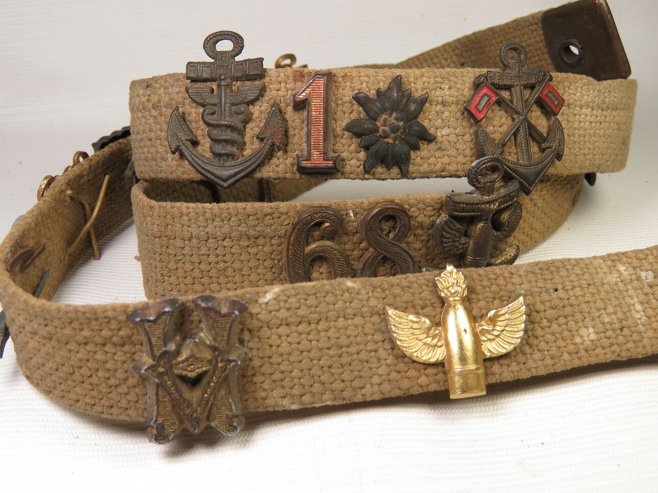 Canvas belt with German insignia, pins and ciphers