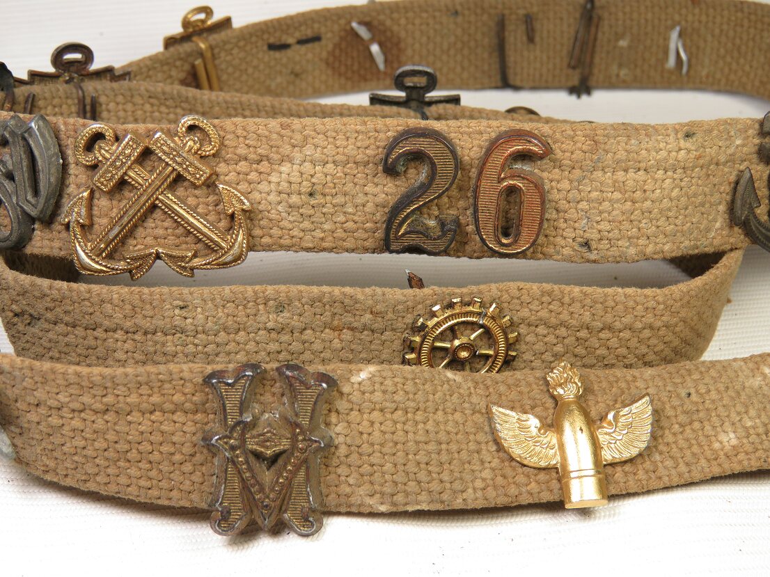 Canvas belt with German insignia, pins and ciphers